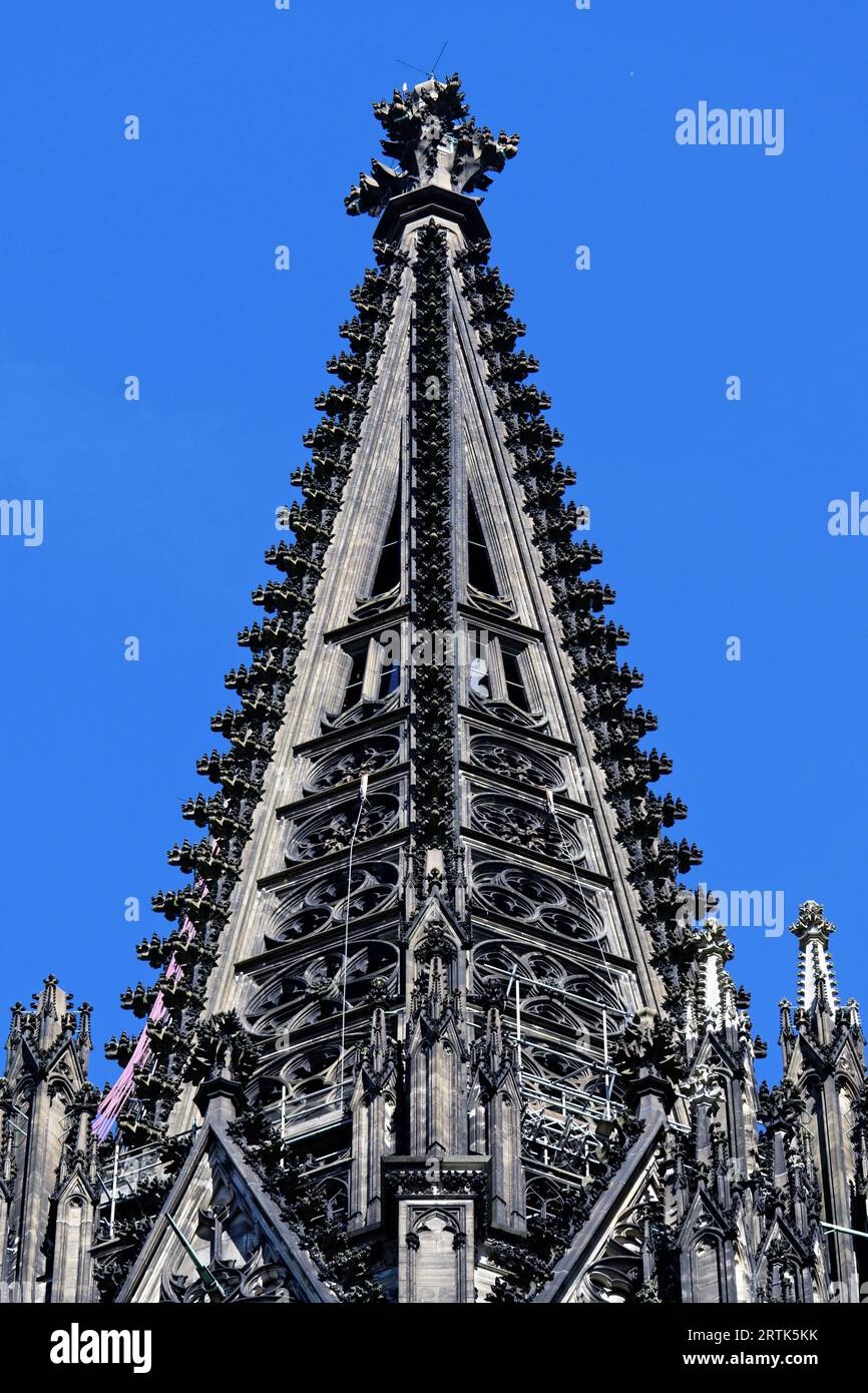 filigree and richly decorated spire of one of the two church towers of ...