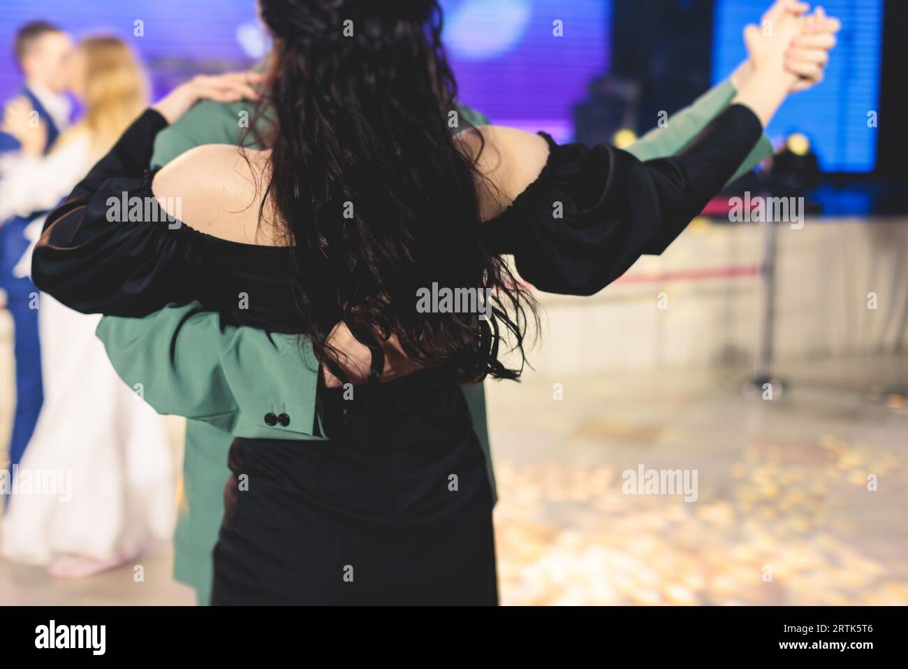 High school graduates dancing waltz and classical ball dance in dresses ...