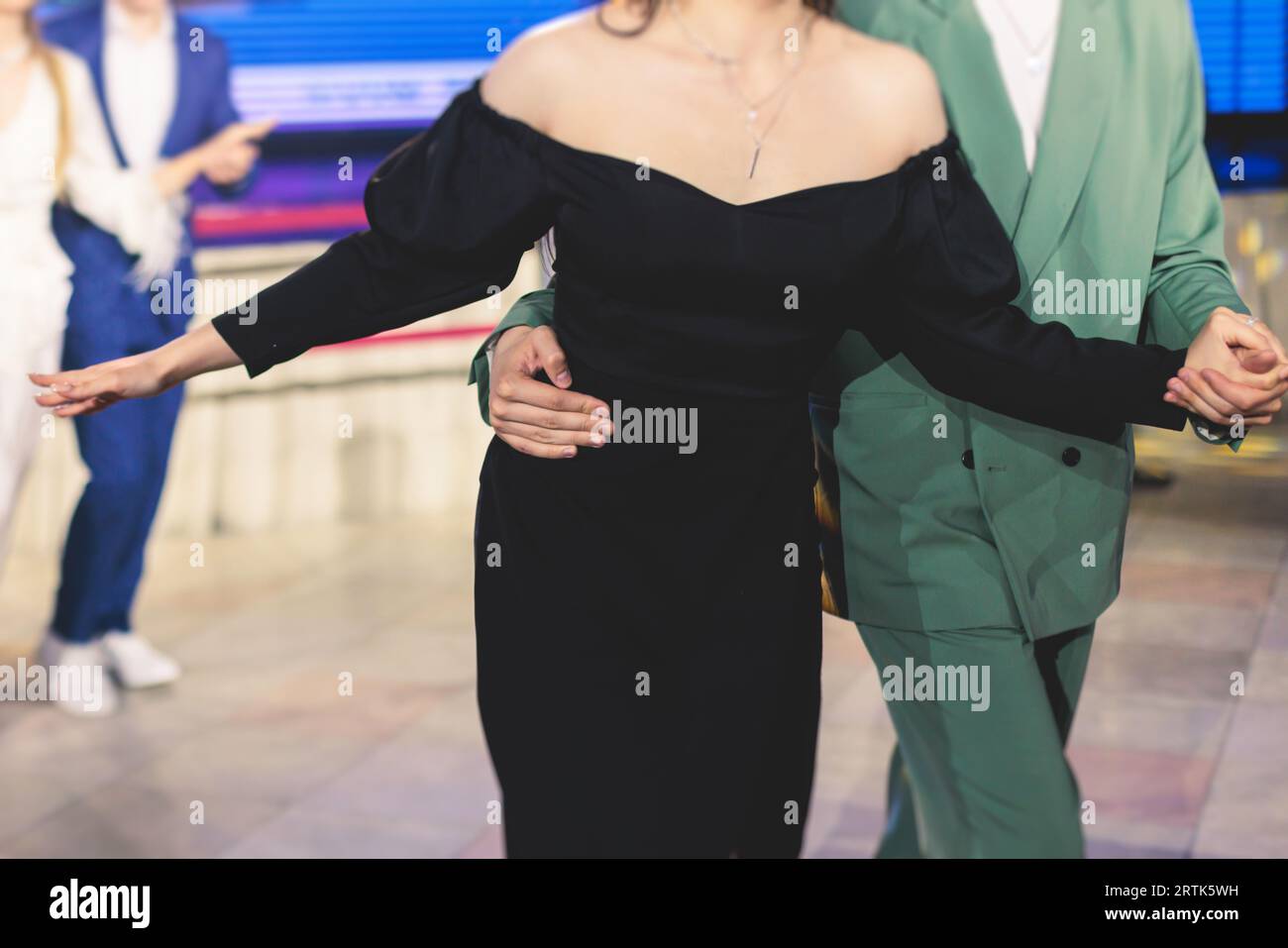 High school graduates dancing waltz and classical ball dance in dresses ...