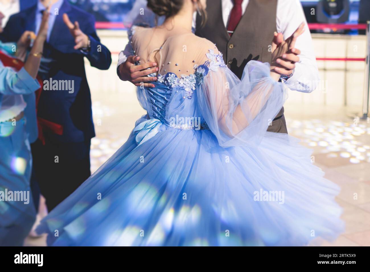High school graduates dancing waltz and classical ball dance in dresses ...