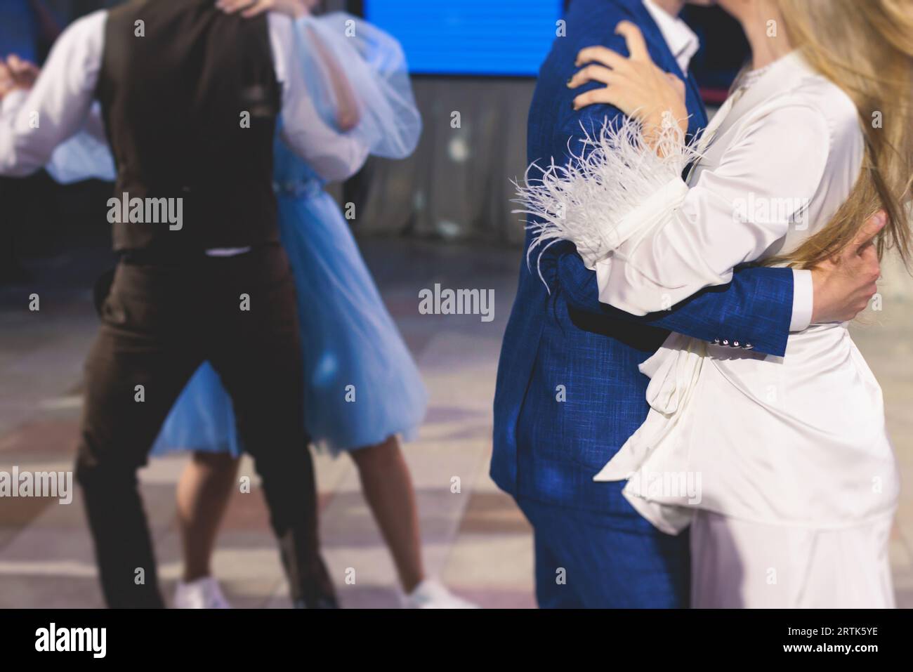 High school graduates dancing waltz and classical ball dance in dresses ...