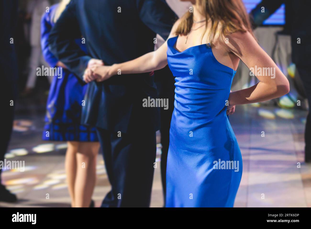 High school graduates dancing waltz and classical ball dance in dresses ...