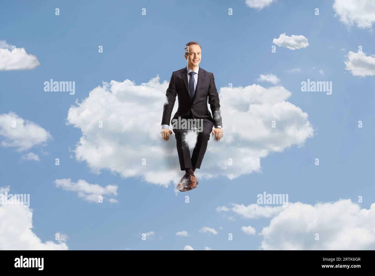 Professional man in suit and tie sitting on a cloud up in the sky Stock ...