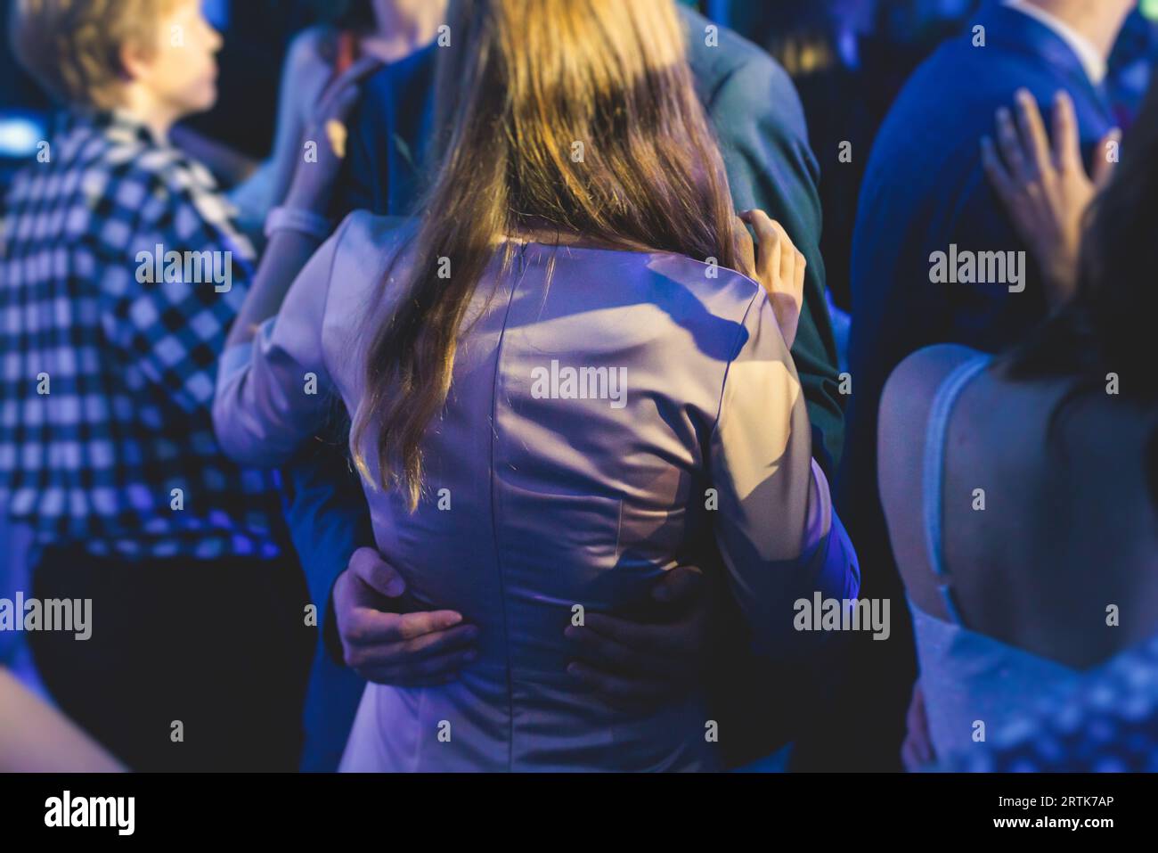 High school graduates dancing waltz and classical ball dance in dresses ...