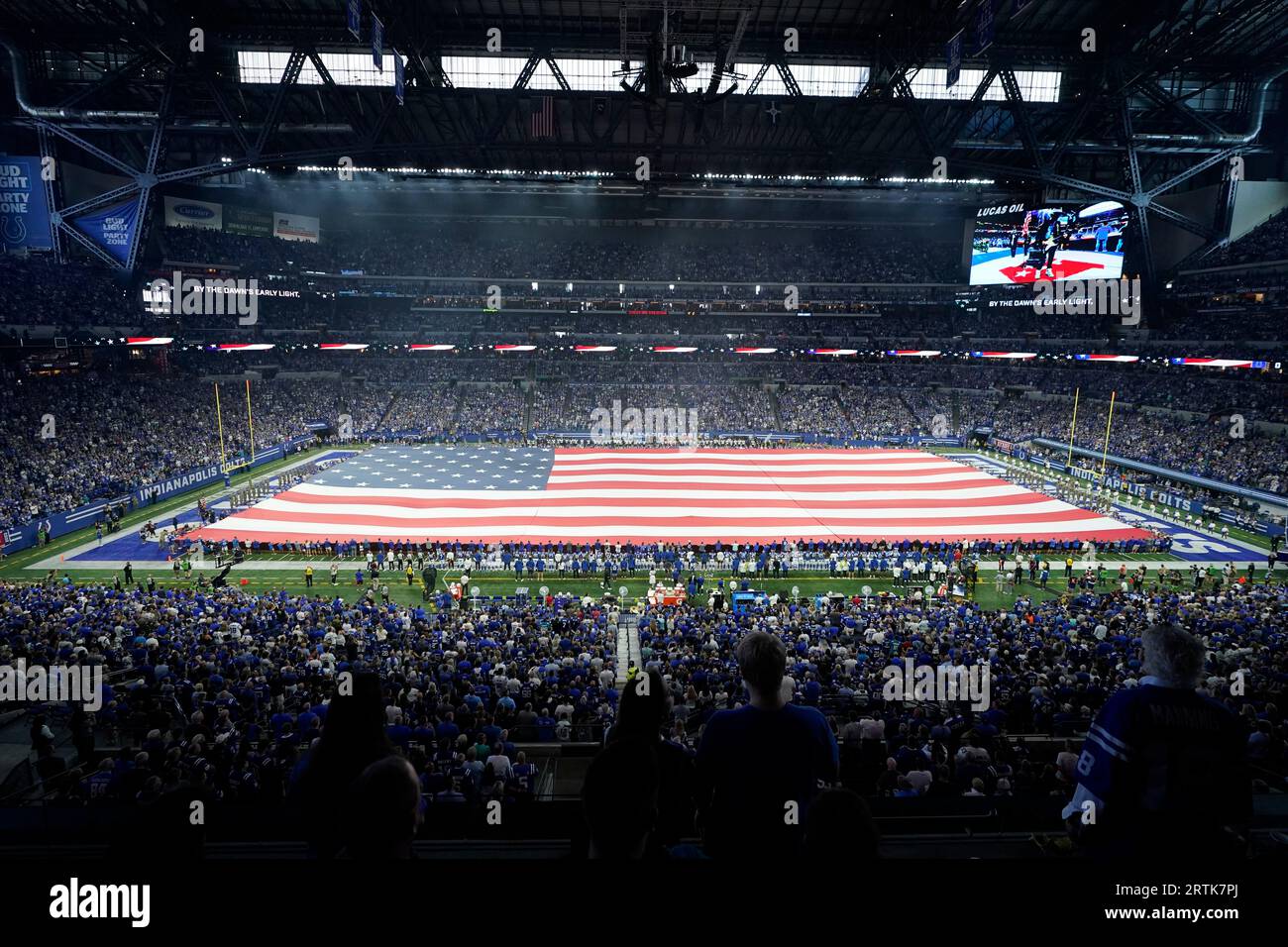 Fans stand during the National Anthem before an NFL football game ...