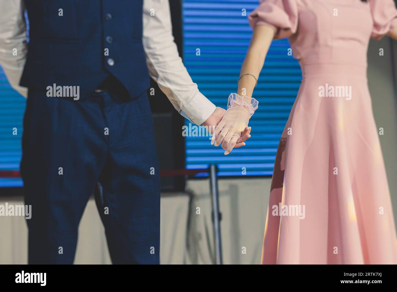 High school graduates dancing waltz and classical ball dance in dresses ...