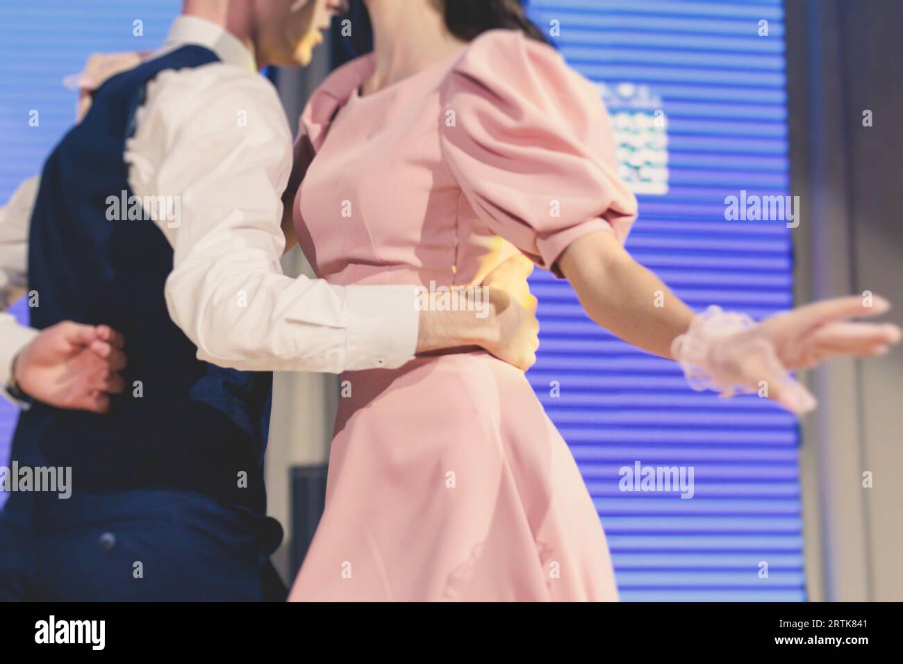 High school graduates dancing waltz and classical ball dance in dresses ...