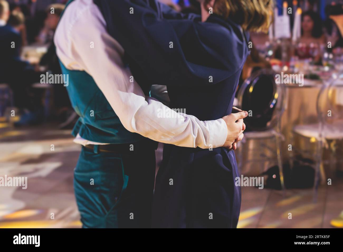 High school graduates dancing waltz and classical ball dance in dresses ...