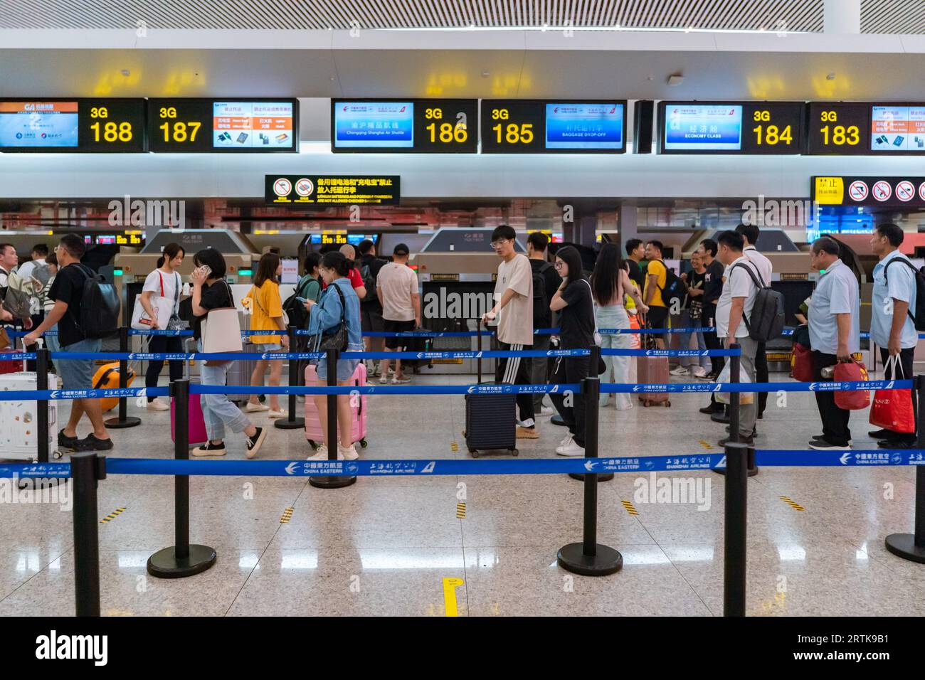 CHONGQING, CHINA - SEPTEMBER 13, 2023 - Passengers check in at Terminal ...