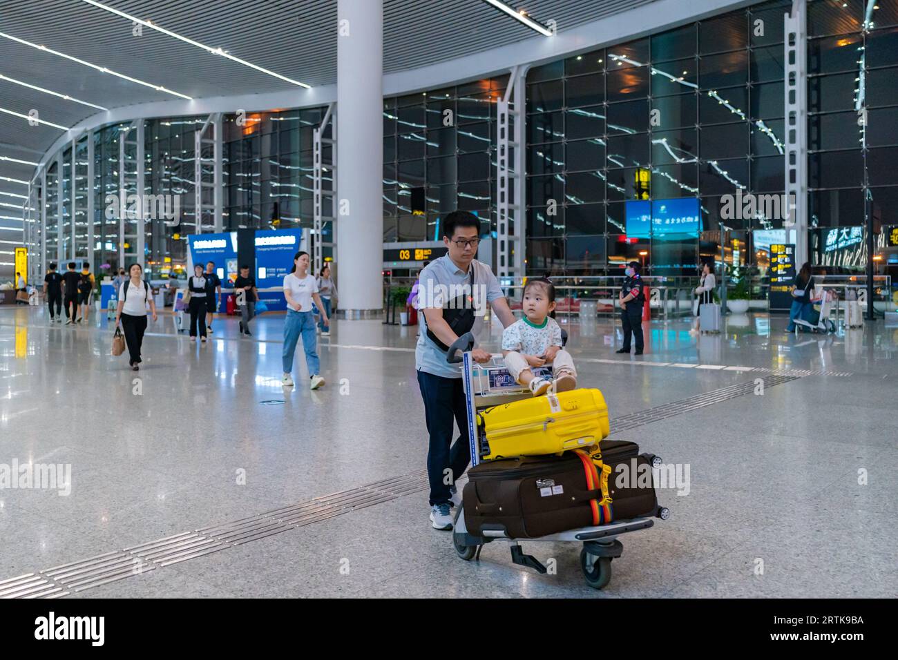 CHONGQING, CHINA - SEPTEMBER 13, 2023 - A father and daughter prepare ...