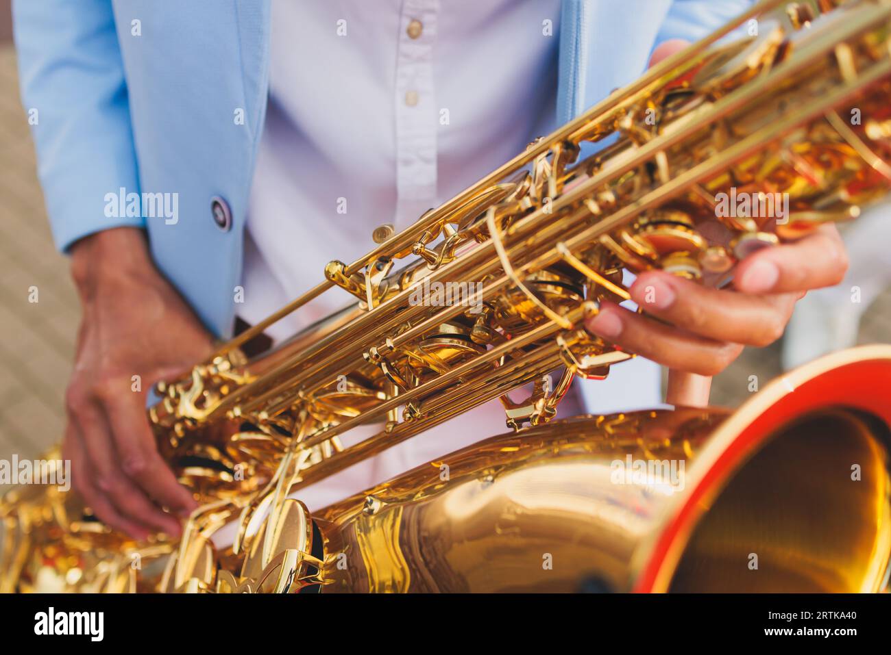 Concert view of saxophonist in a blue and white suit, saxophone sax ...