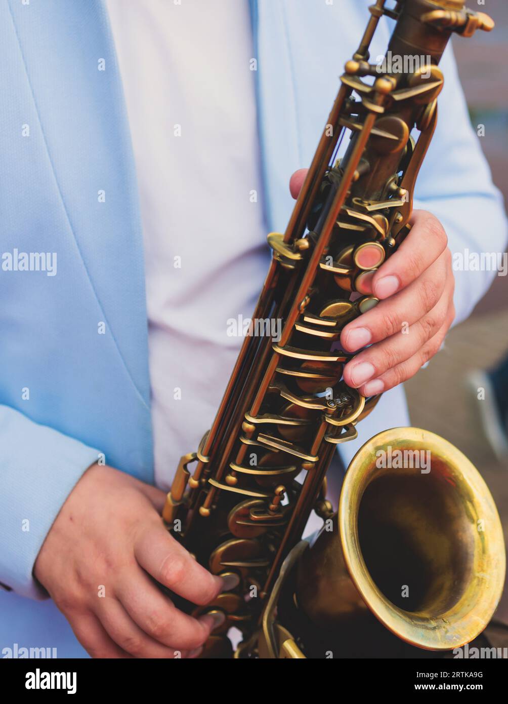Concert view of saxophonist in a blue and white suit, saxophone sax ...