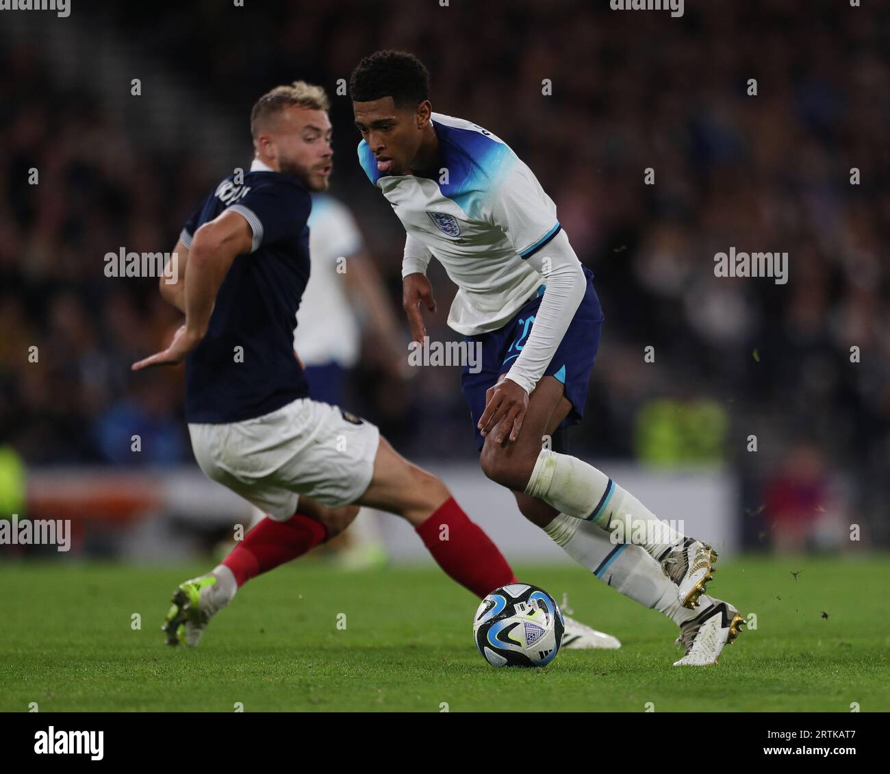 England's Jude Bellingham in action with Scotland's Ryan Porteous ...