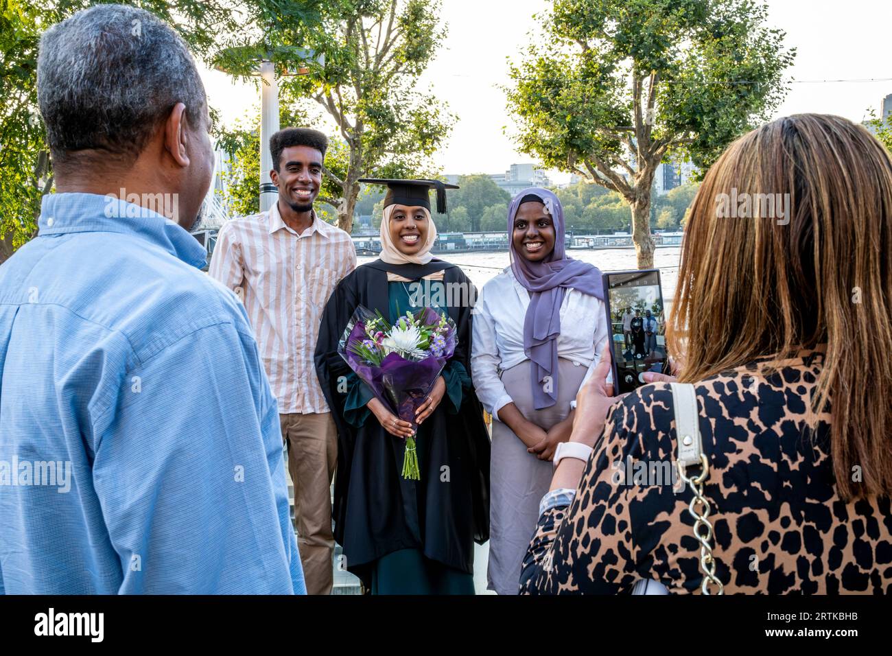 A Muslim Degree Student Poses For A Photo With Her Family At Her ...