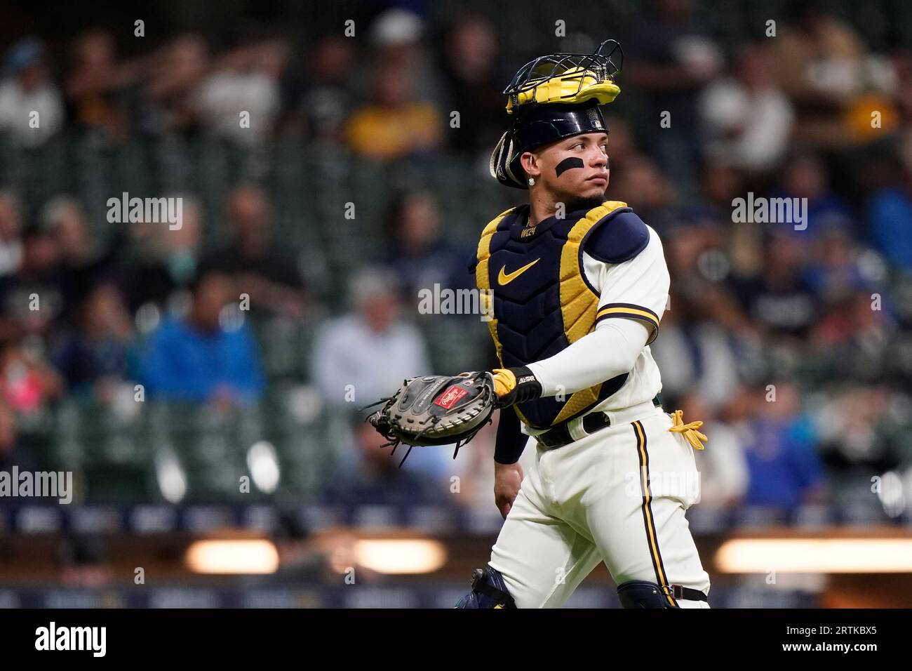 Milwaukee Brewers' William Contreras walks back to the plate after a ...