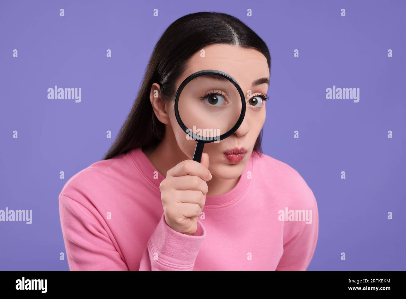 Woman magnifier lens on eye hi-res stock photography and images - Alamy