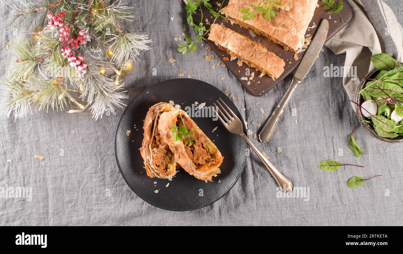 Puff pastry vegetable roll on kitchen decorated countertop Stock Photo ...