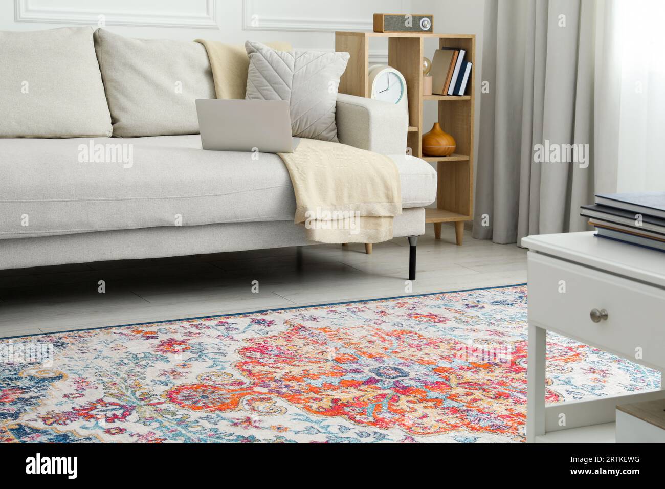 Stylish living room with beautiful carpet and comfortable sofa ...