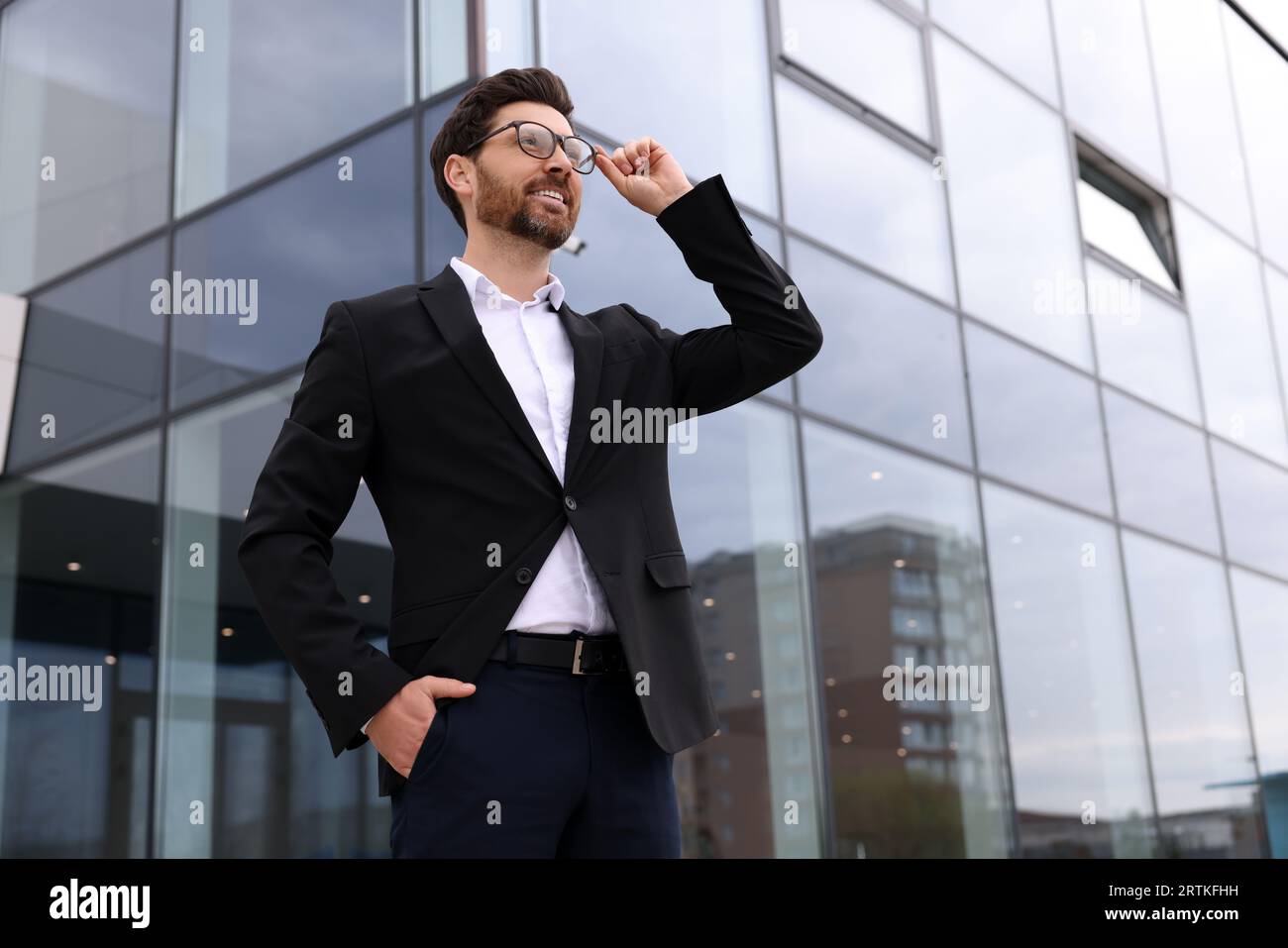 Happy real estate agent outdoors. Space for text Stock Photo - Alamy
