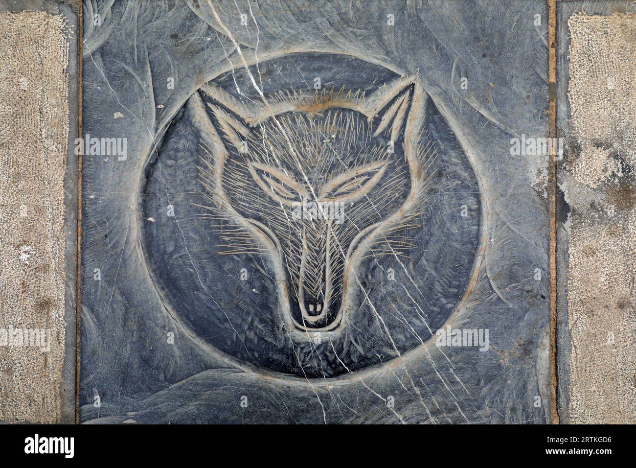 Wolf head sculpture on the ground, North China Stock Photo - Alamy
