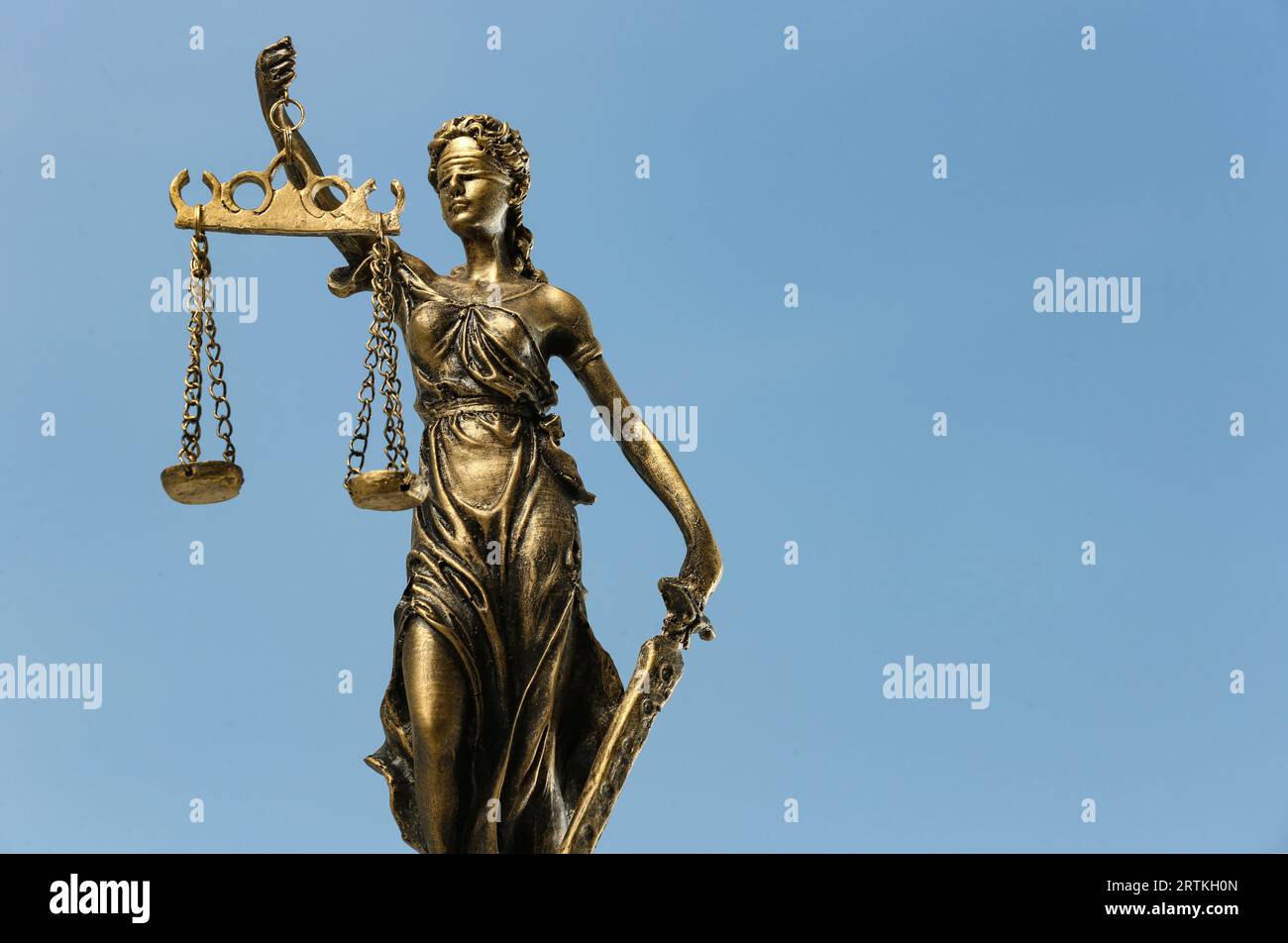 Symbol of fair treatment under law. Figure of Lady Justice against sky ...