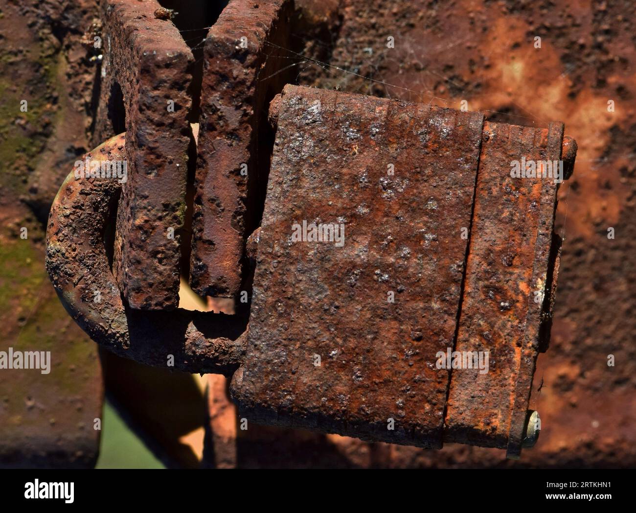 Rusted padlock on a rusty metal post. Isolated closeup corroded padlock ...