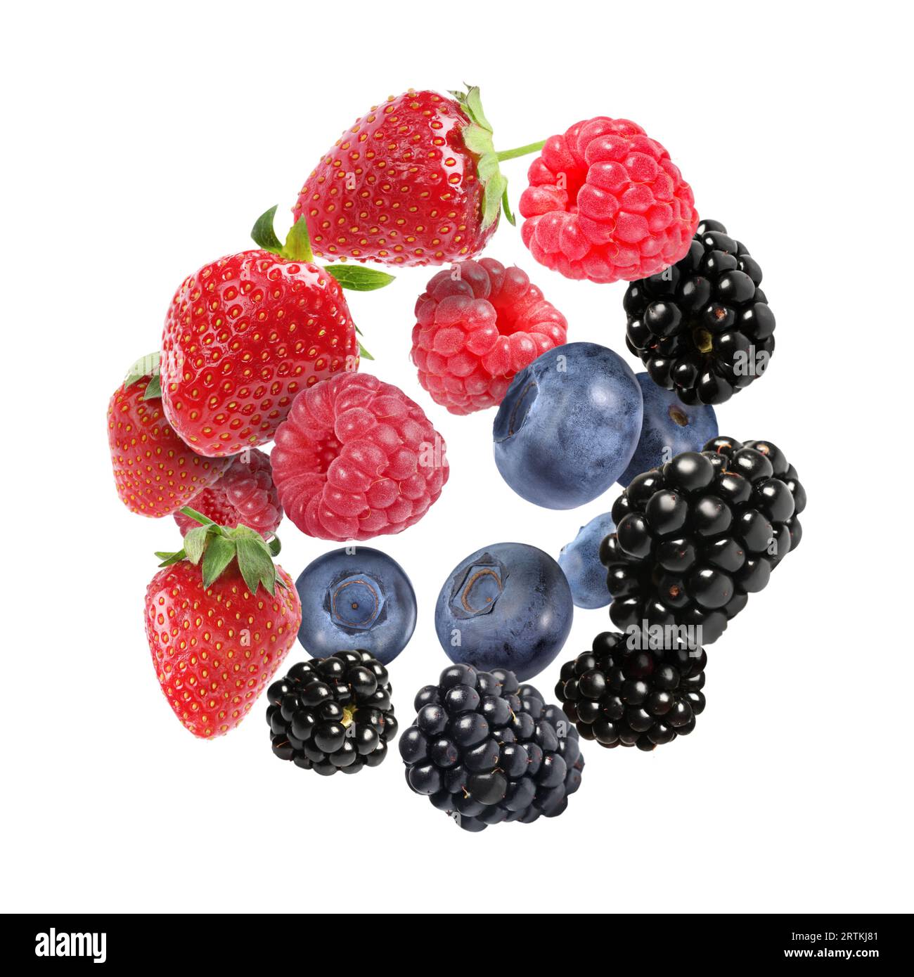 Many different berries flying on white background Stock Photo - Alamy