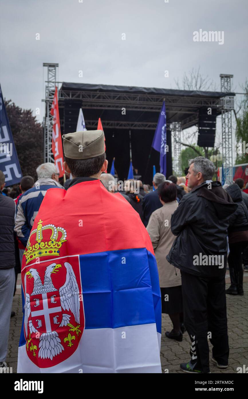 Picture of a man wrapped in a serbian flag wearing a sajkaca, a serbian ...
