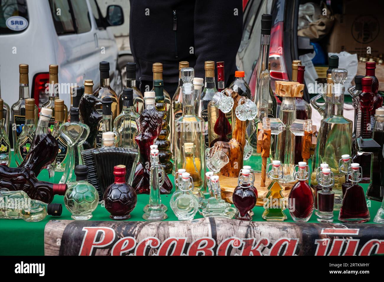 Picture of various rakijas displayed In Kacarevo, in a market, in ...