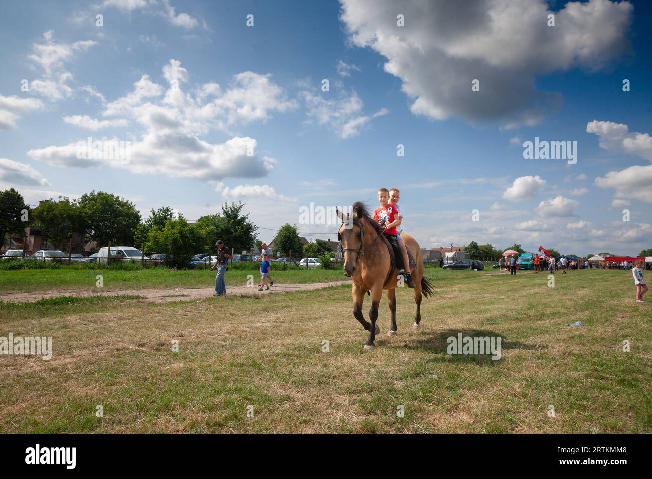 Picture of two young boys riding a horse in the Rumska Straparijada ... Picture of two young boys riding a horse in the Rumska Straparijada ...