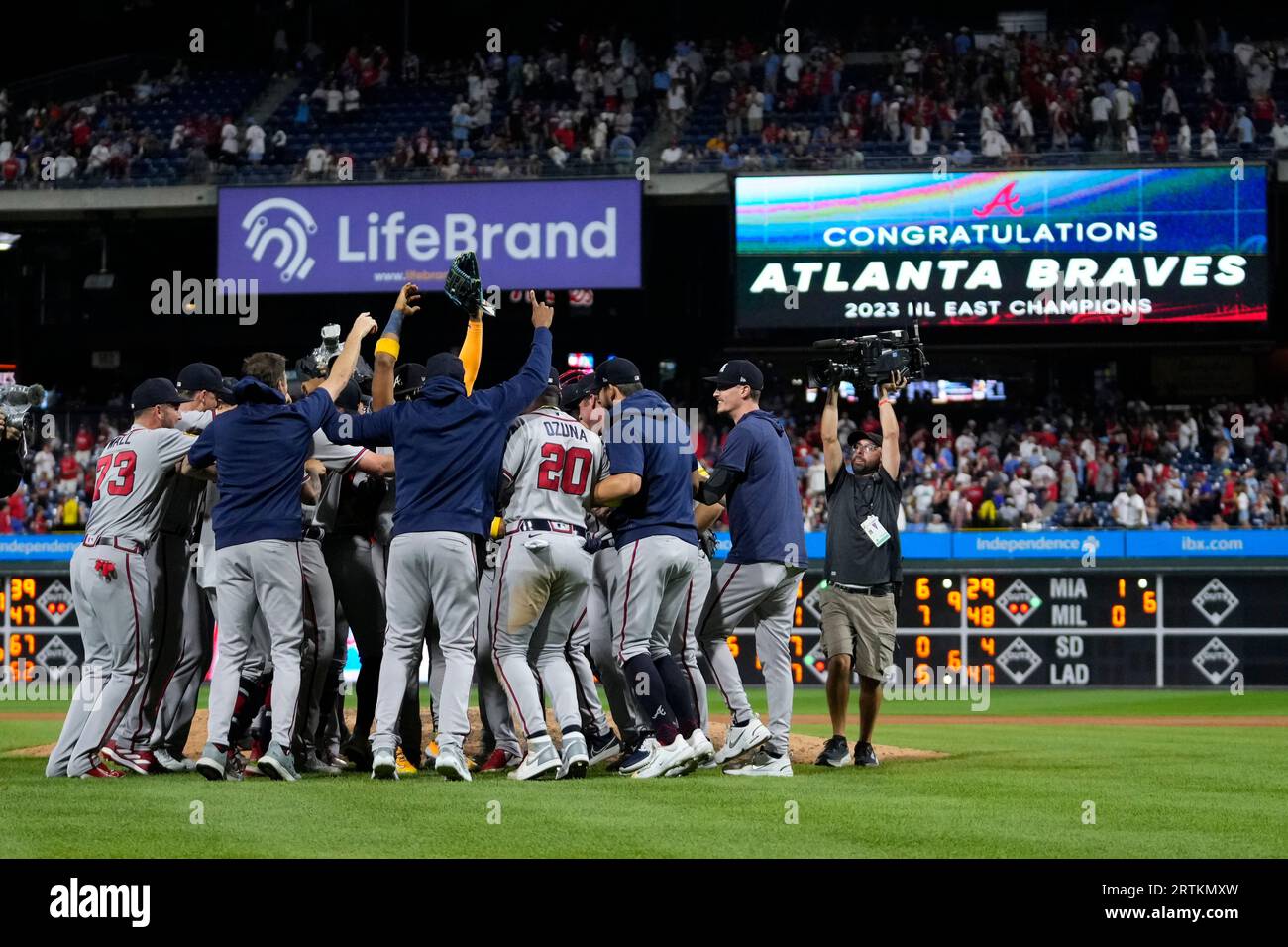 Atlanta Braves players and coaches celebrate after clinching their ...