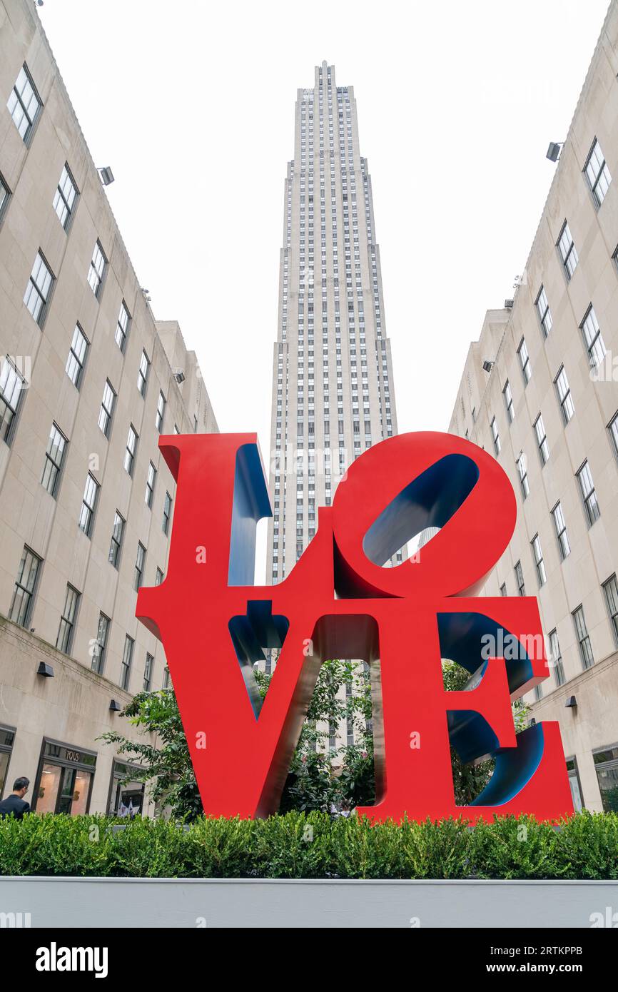 People walk, take photos of art installations created by Robert Indiana ...