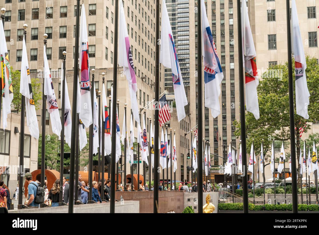 People walk, take photos of art installations created by Robert Indiana ...