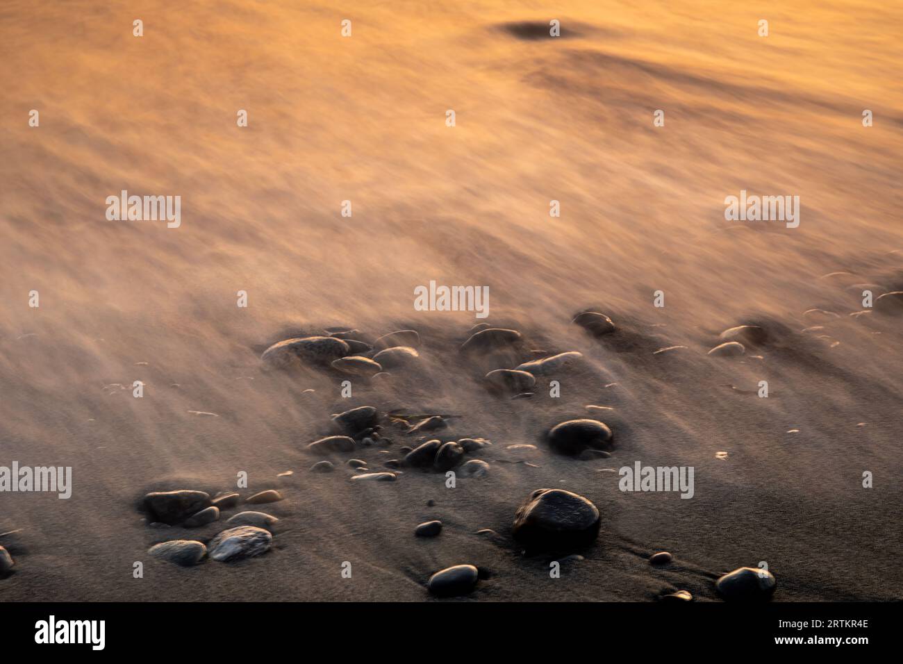 WA23593-00...WASHINGTON - Incoming tide at West Beach at sunset in ...