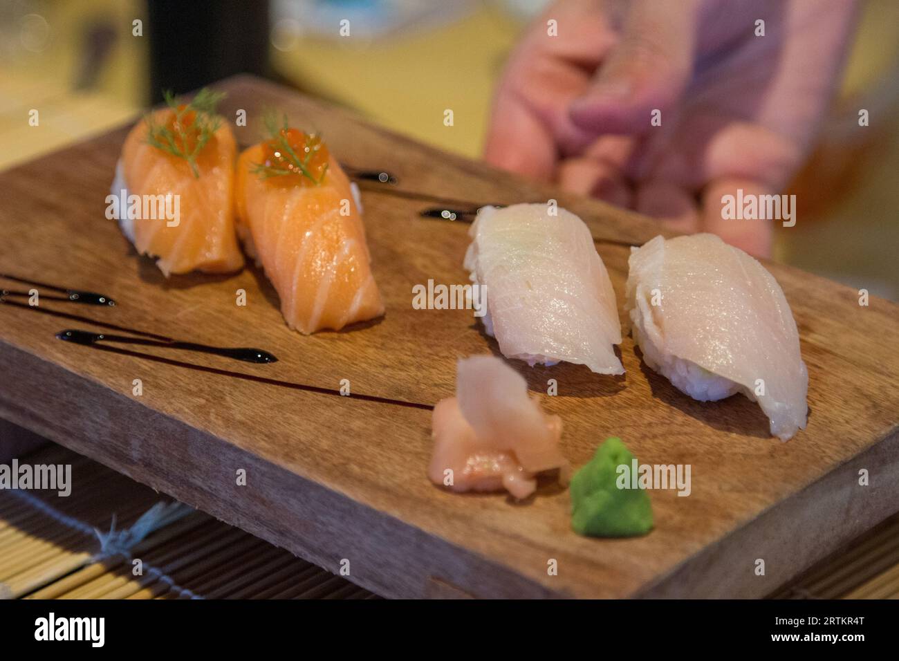 Sushi Chef serving sushi at a Japanese Restaurant Stock Photo - Alamy