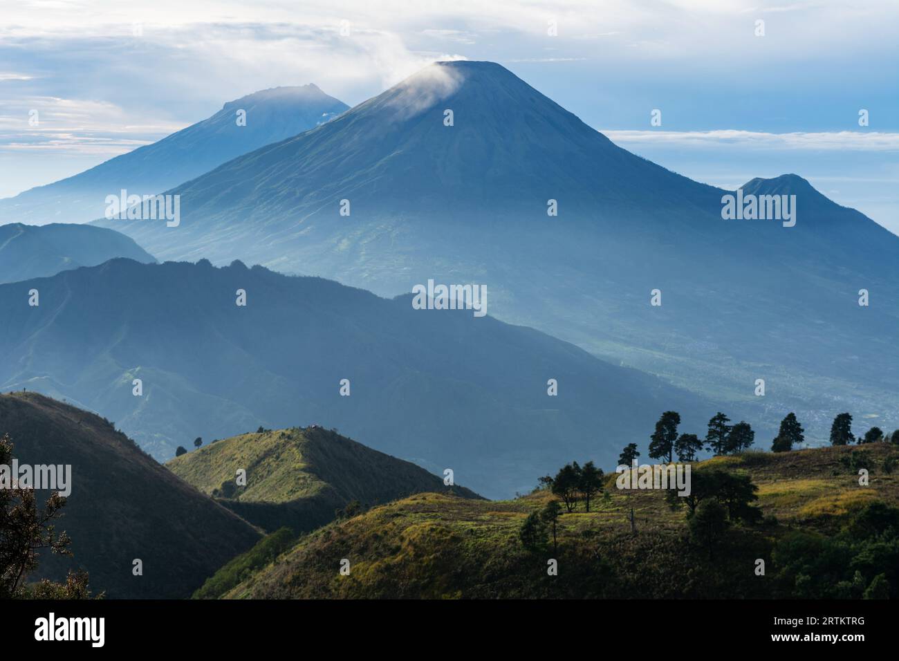 The view of lined mountains from the top of Mount Prau is very ...