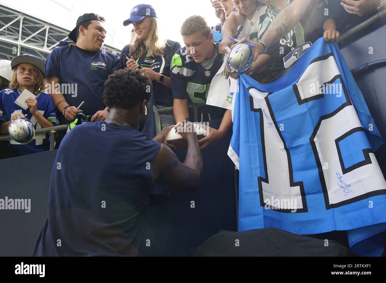 Seattle Seahawks quarterback Geno Smith (7) signs autographs before an ...