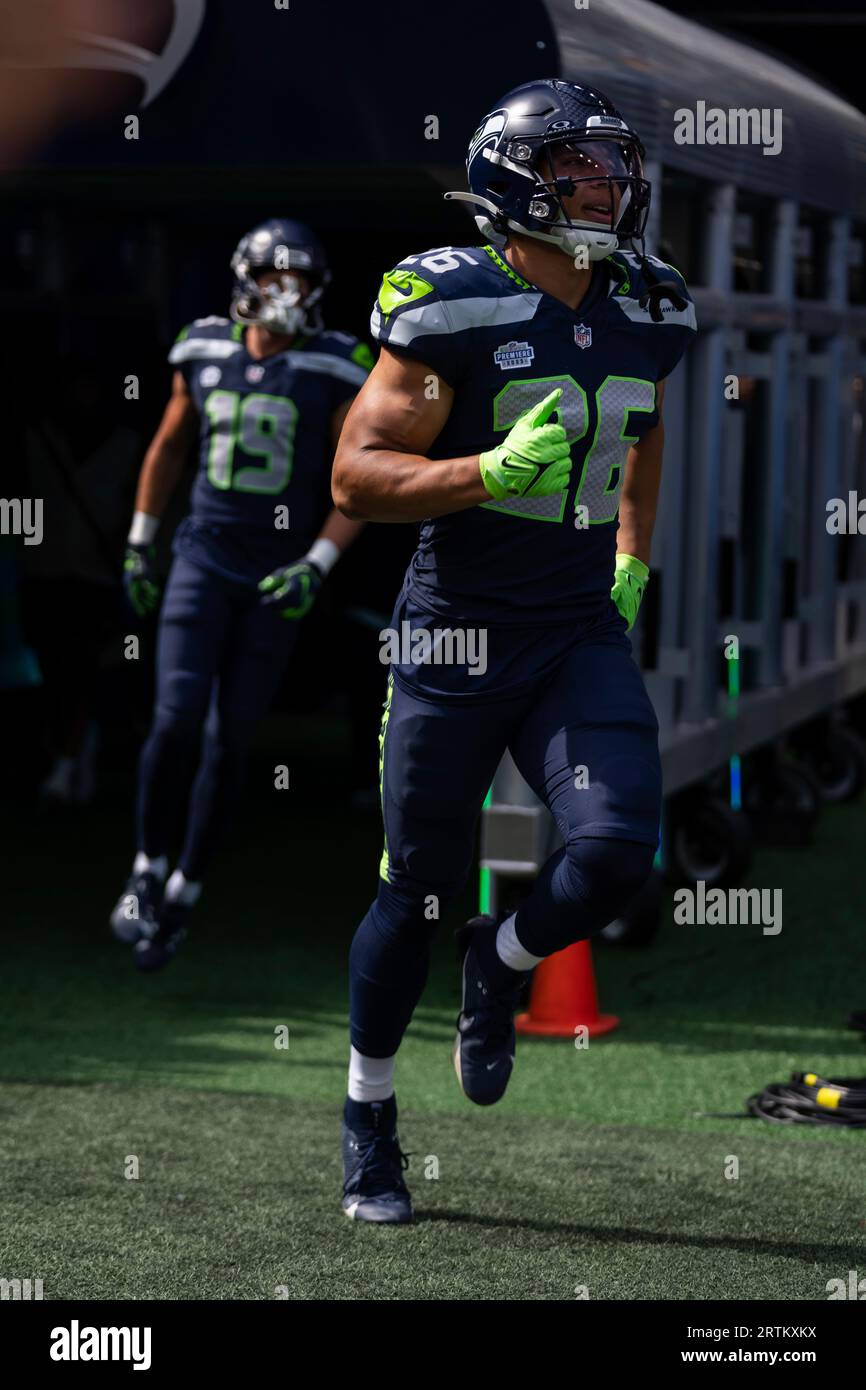 Seattle Seahawks running back Zach Charbonnet (26) runs out on to the ...