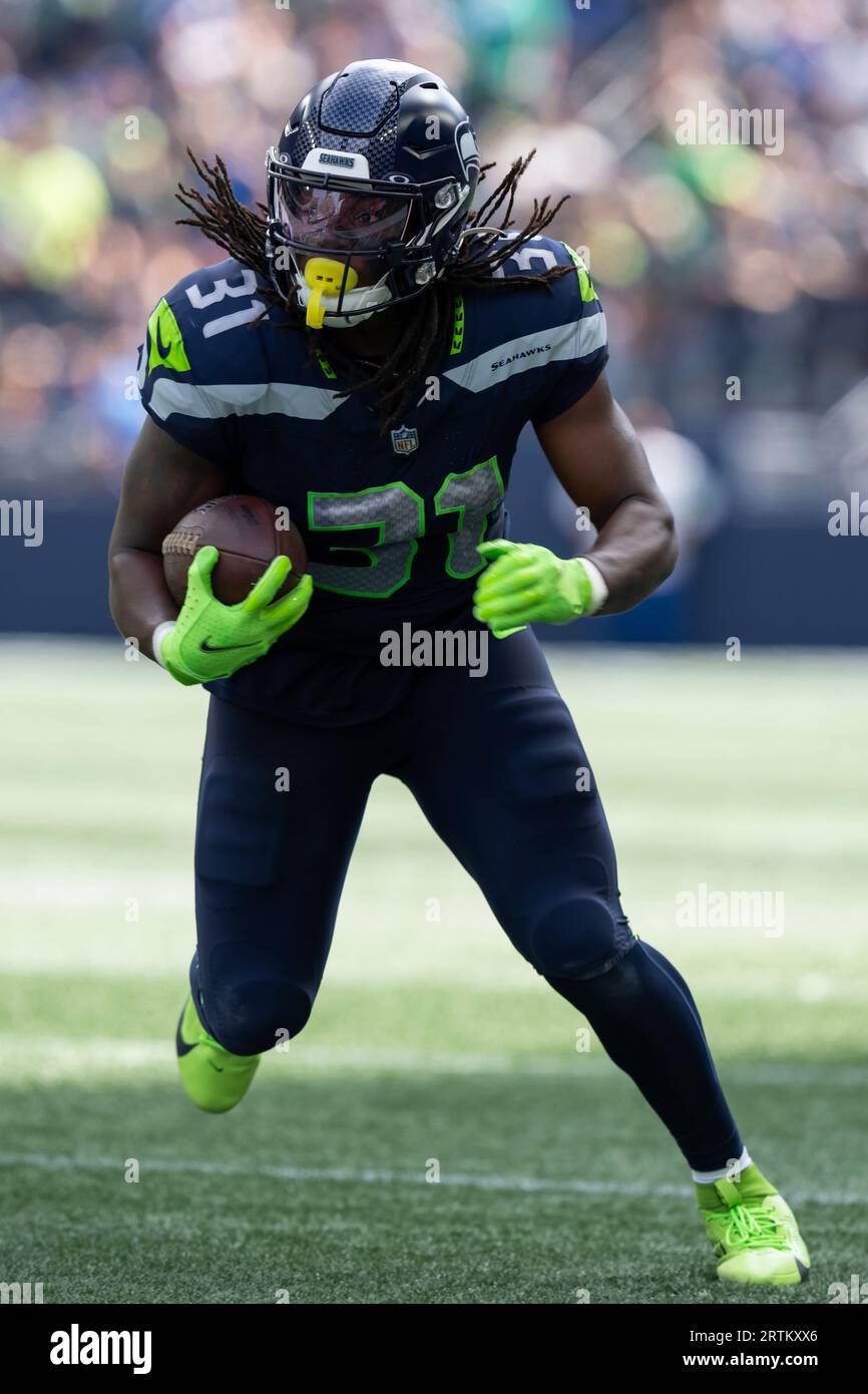 Seattle Seahawks running back DeeJay Dallas (31) runs with the ball ...