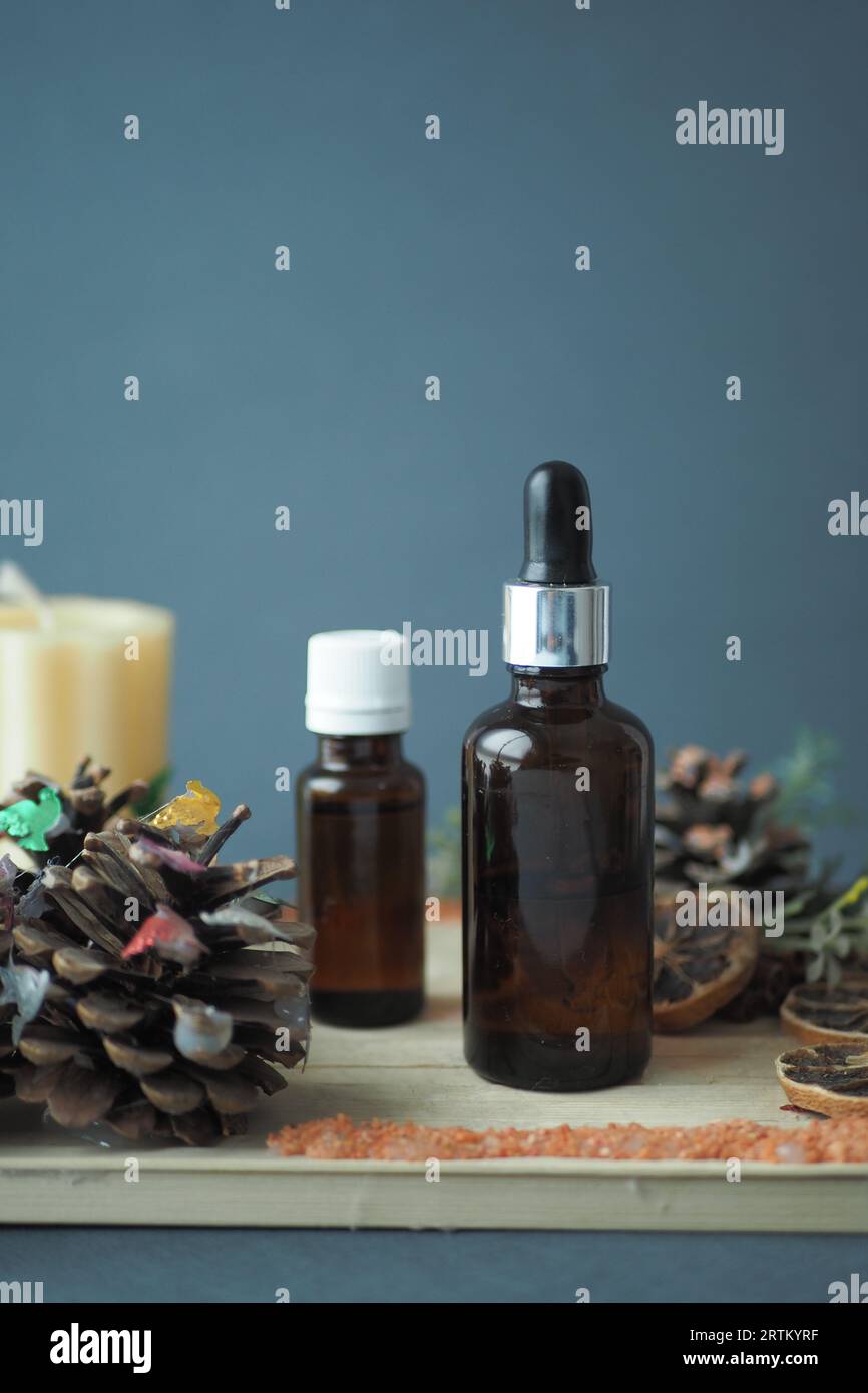 eucalyptus essential oils in a glass bottle with green leaf on white ...