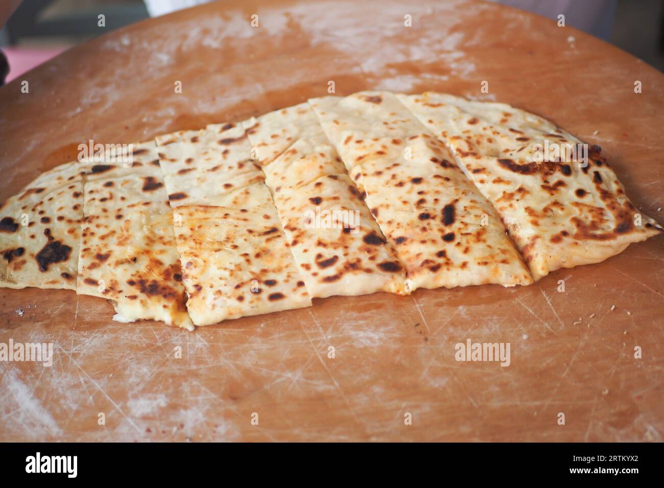 cooking roti chapati on a big cooking pan Stock Photo - Alamy
