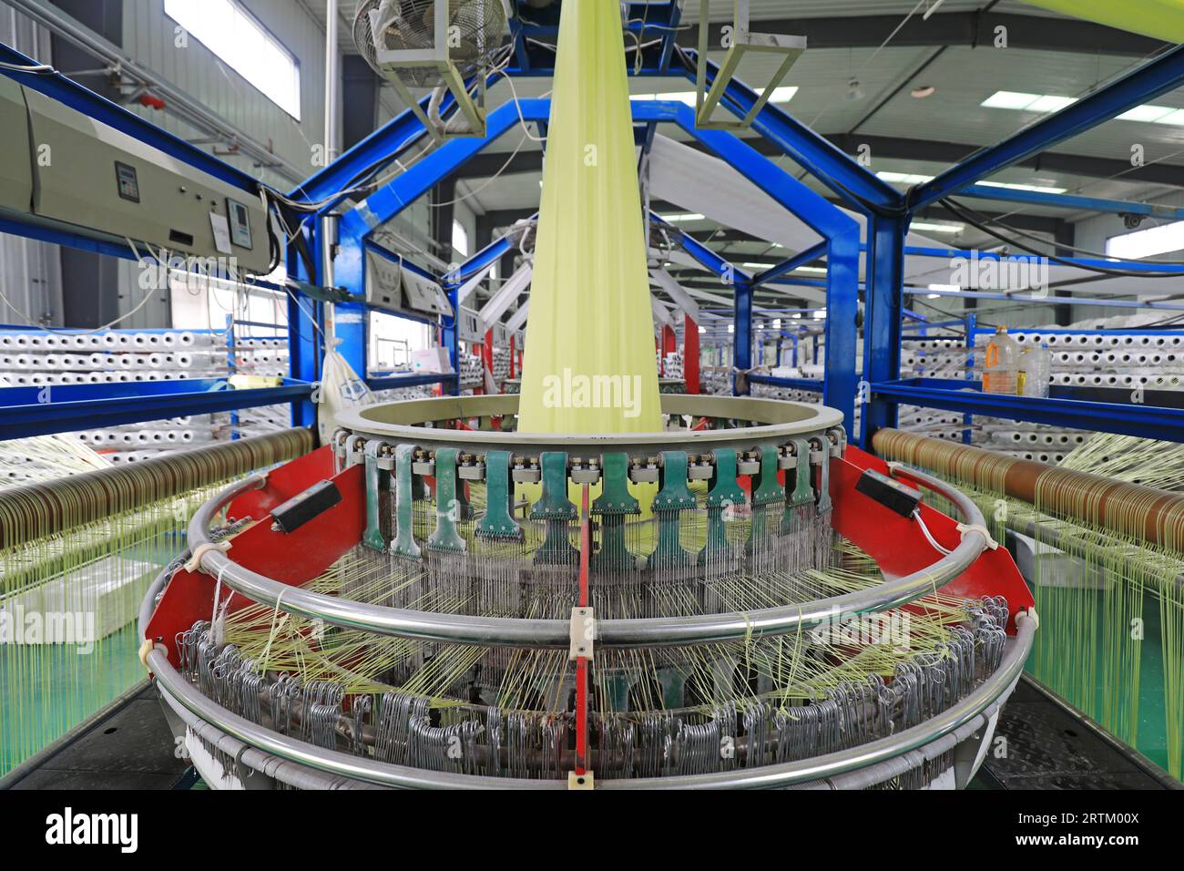 Mechanical equipment of plastic weaving factory Stock Photo - Alamy