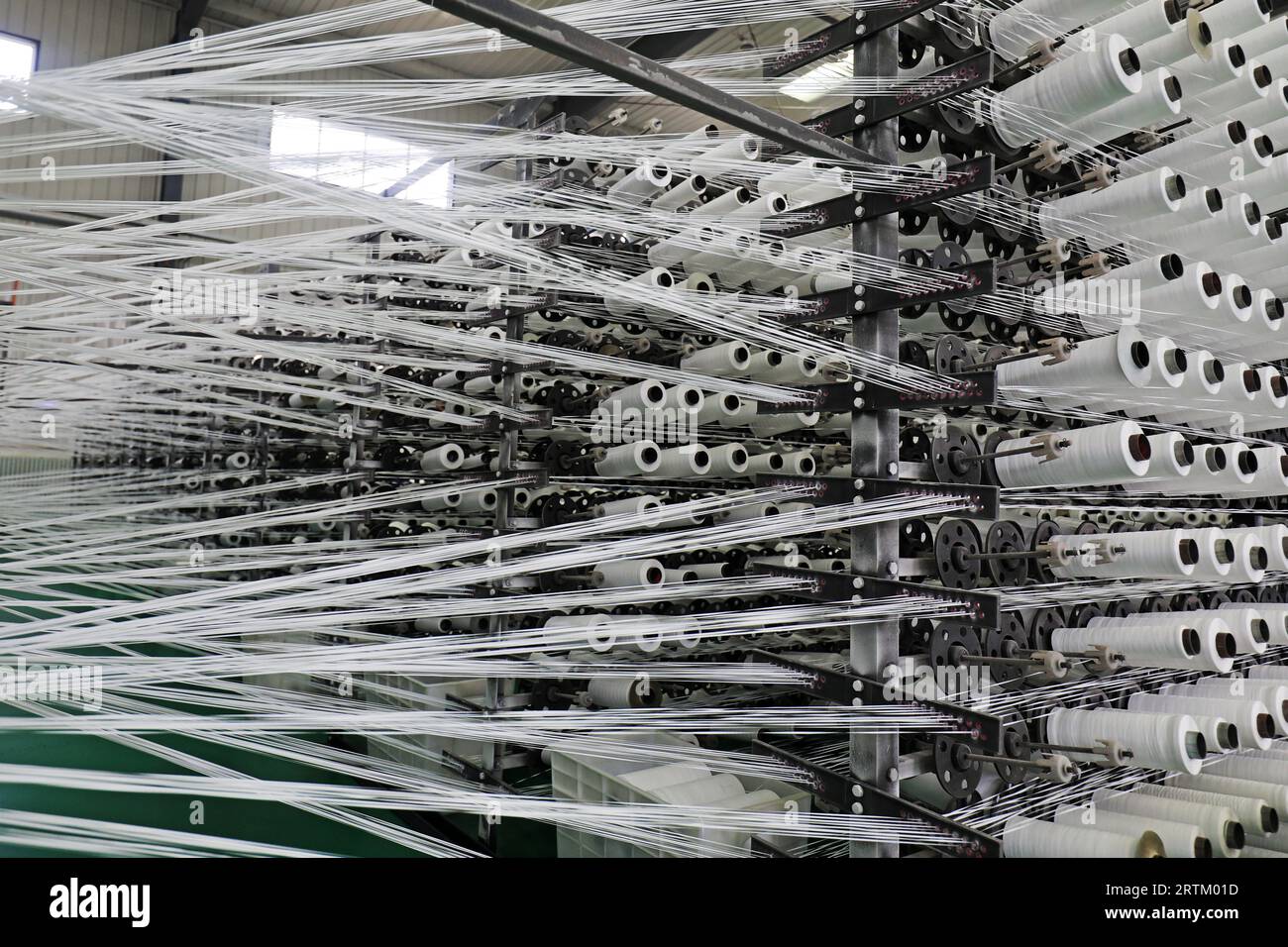 Mechanical equipment of plastic weaving factory Stock Photo - Alamy