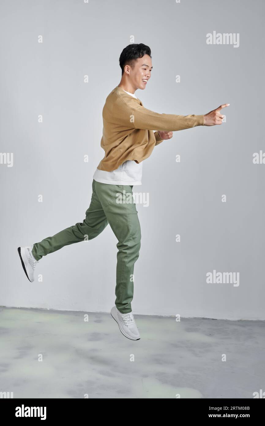 Asian guy pointing hi-res stock photography and images - Alamy