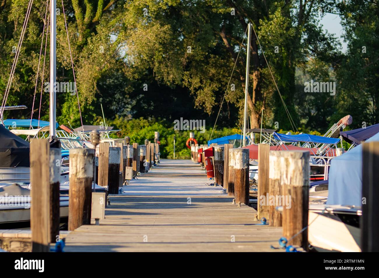 Looking down a long wooden dock at Allan H Treman State Marine Park ...
