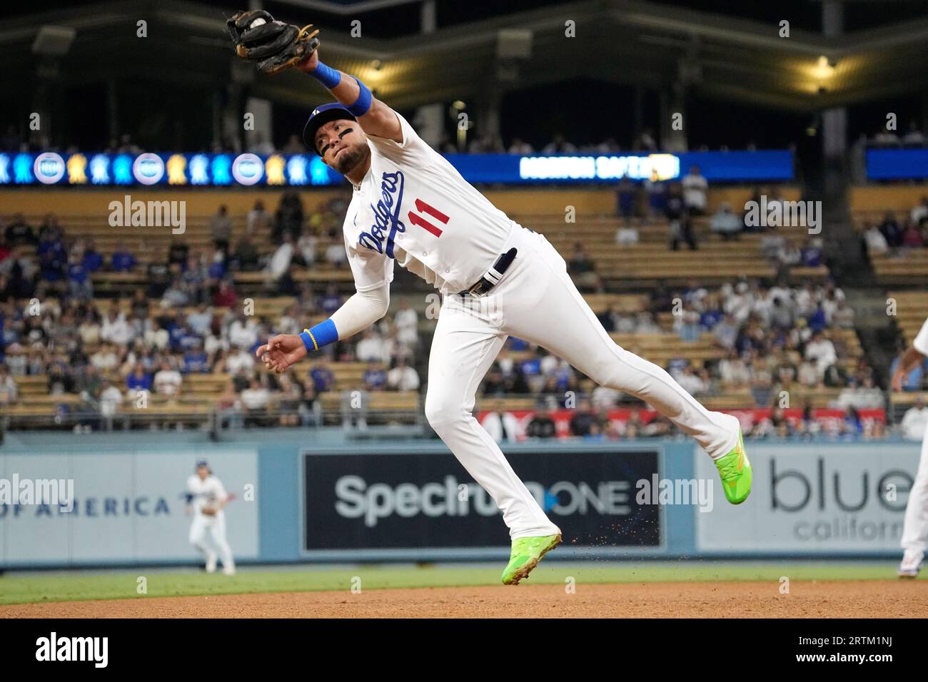 Los Angeles Dodgers third baseman Miguel Rojas makes a catch on a ball ...