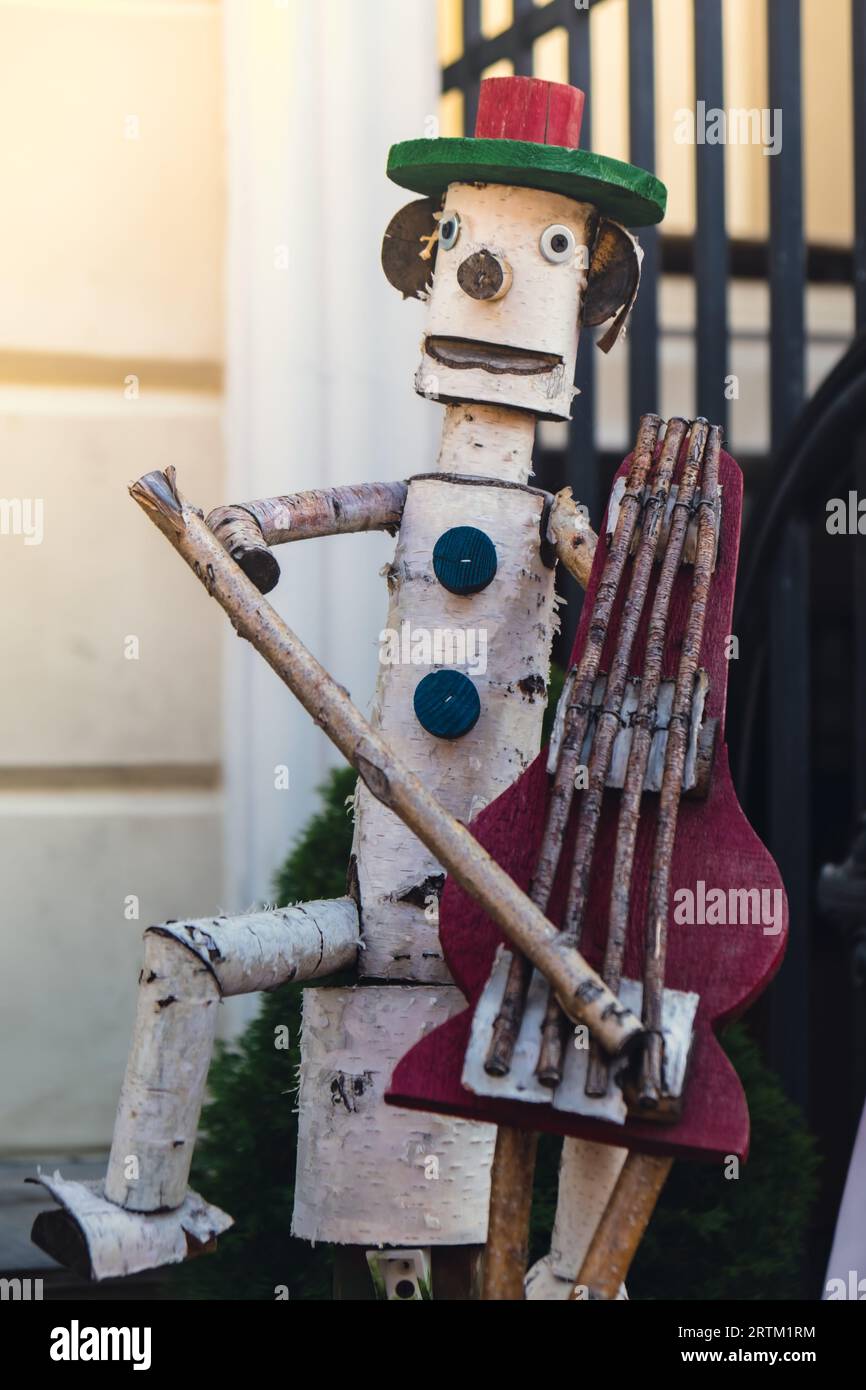 Pinocchio wooden puppet playing musician instrument. Antique and used ...