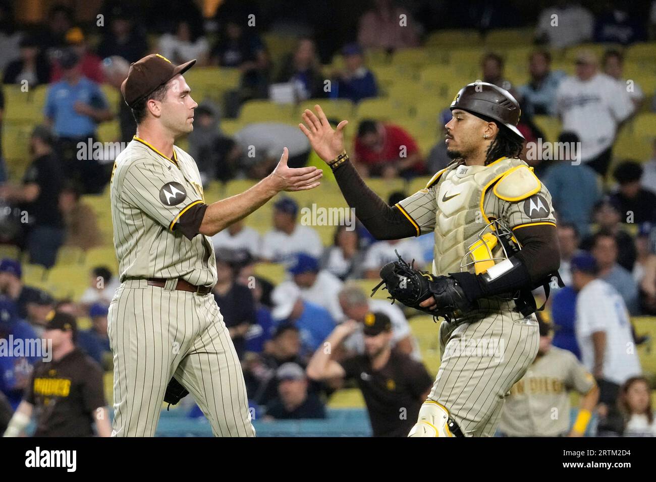 San Diego Padres relief pitcher Tom Cosgrove, left, and catcher Luis ...