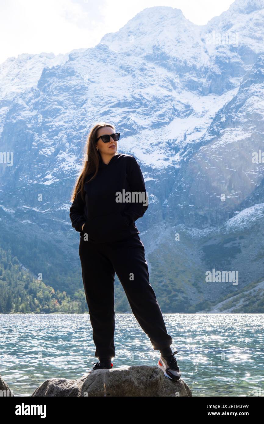 Young woman enjoying nature in Morskie Oko Snowy Mountain Hut in Polish ...
