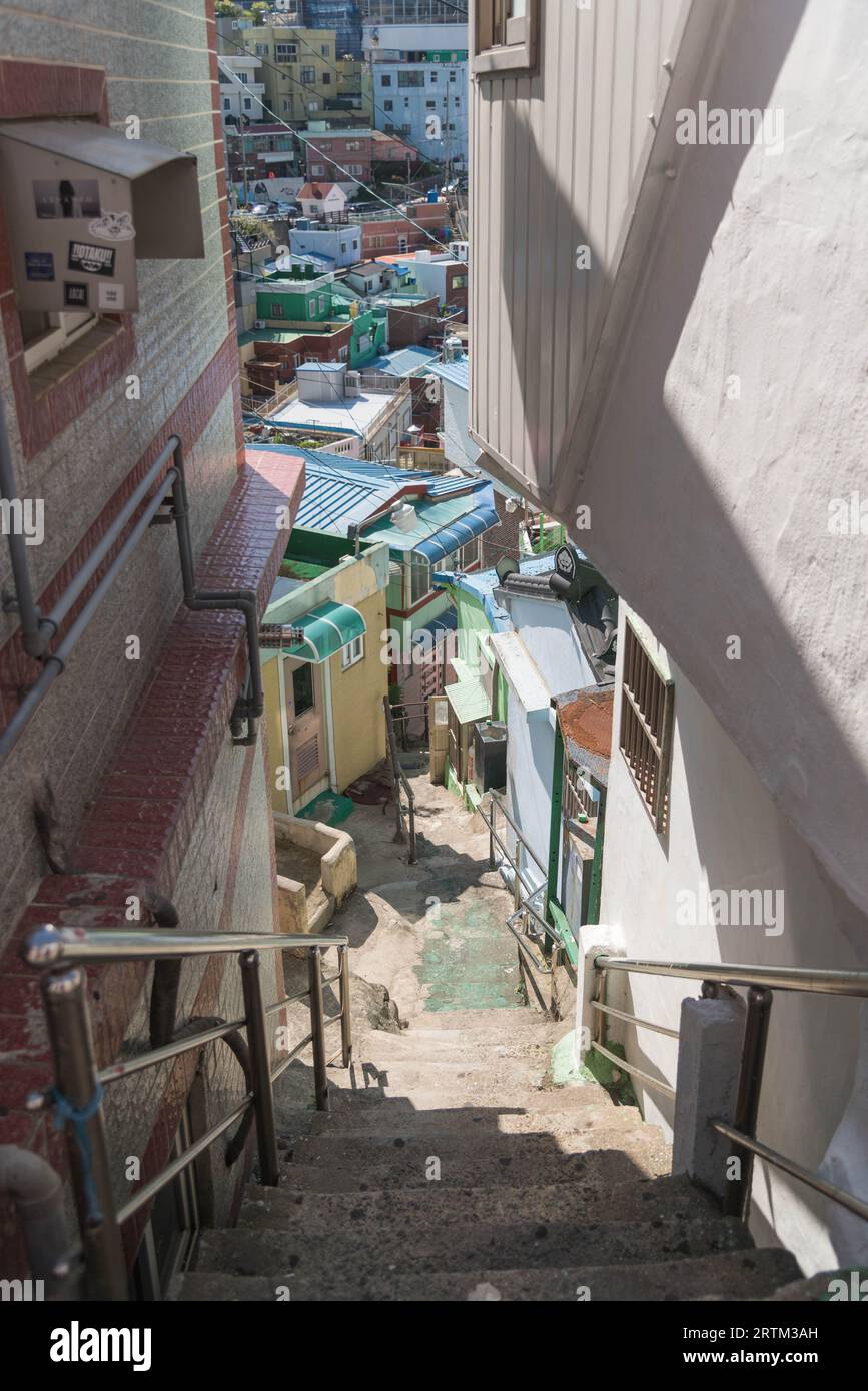 A narrow flight of stairs going downwards Stock Photo - Alamy